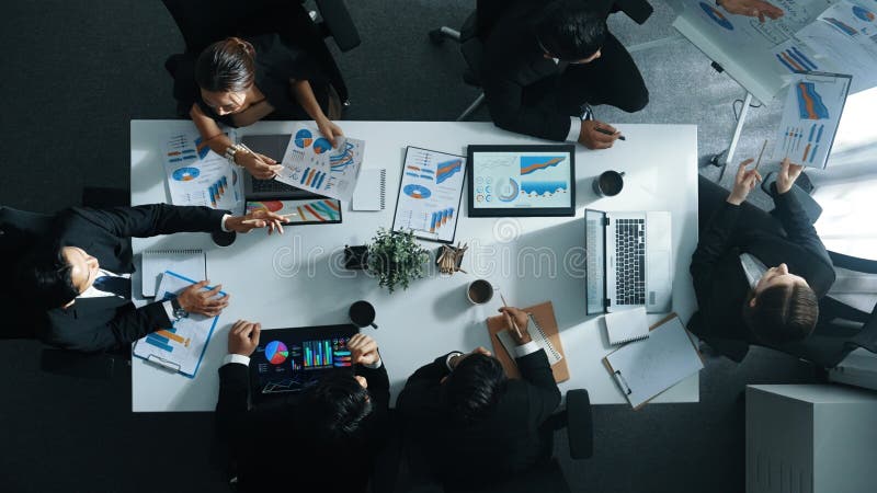 Top View of Smart Manager Writing at Chart while Looking at Data ...