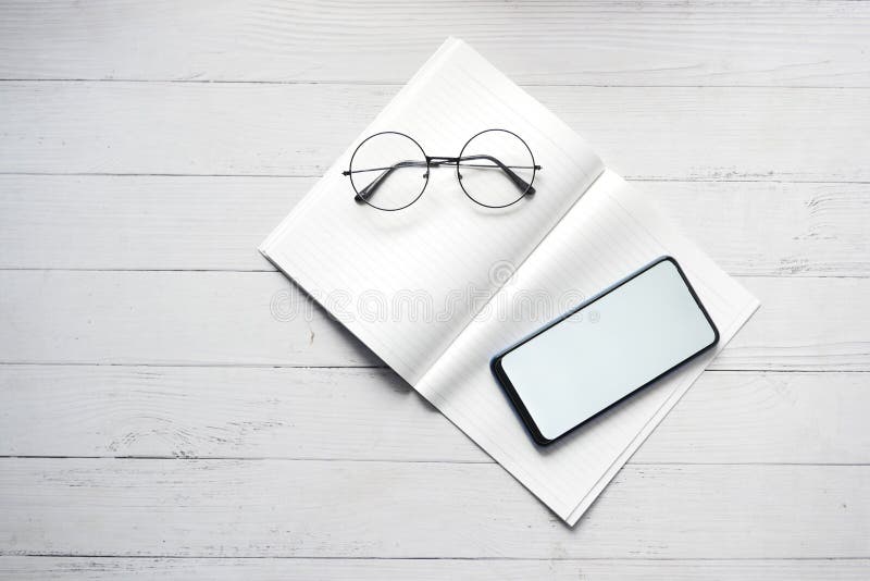 Top View of Smart Phone and Notepad on Table Stock Image - Image of ...