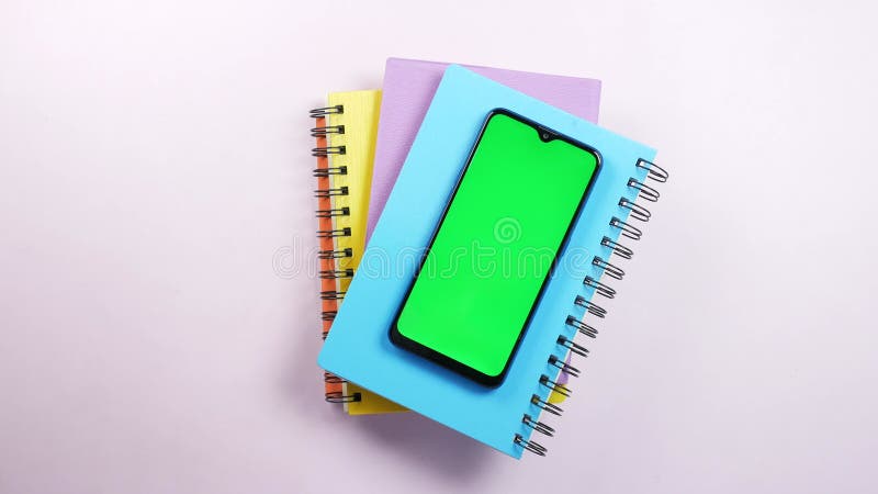 Top View of Smart Phone and Notepad on Table Stock Video - Video of ...
