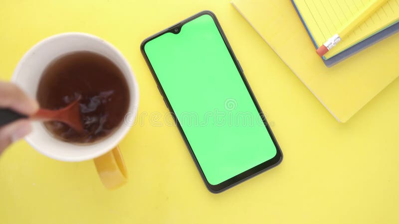 Top View of Smart Phone and Notepad on Yellow Background Stock Video ...