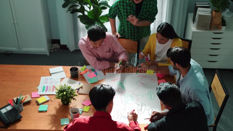 Top View of Smart Team Brainstorming and Writing Mind Map Together ...