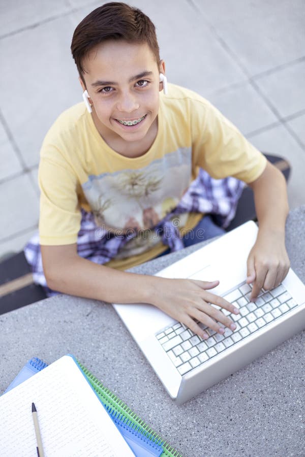 Top View of Smiling Teenager Boy Using Laptop Computer Stock Image ...