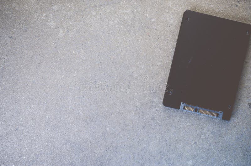 Top View of Solid-state Drive on a Rough Textured Background with Copy ...
