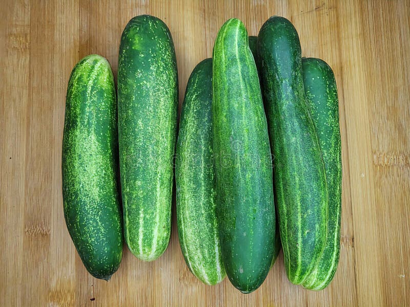 Top View of Some Cucumbers Lying on a Wooden Table Stock Image - Image ...