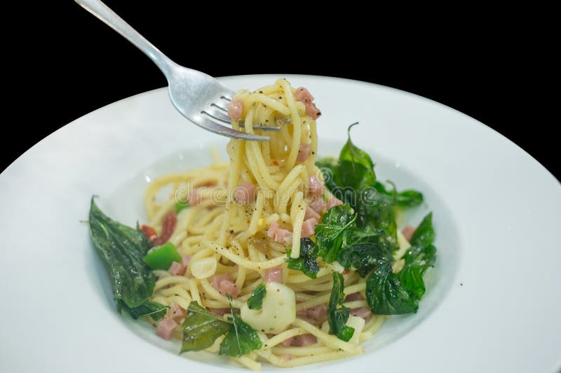 Top View of Spaghetti Carbonara with Fork on White Dish in Black ...