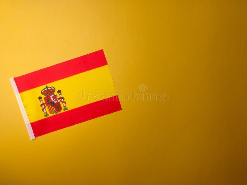 Top View Spain Flag on a Yellow Background with Copy and Text Space ...