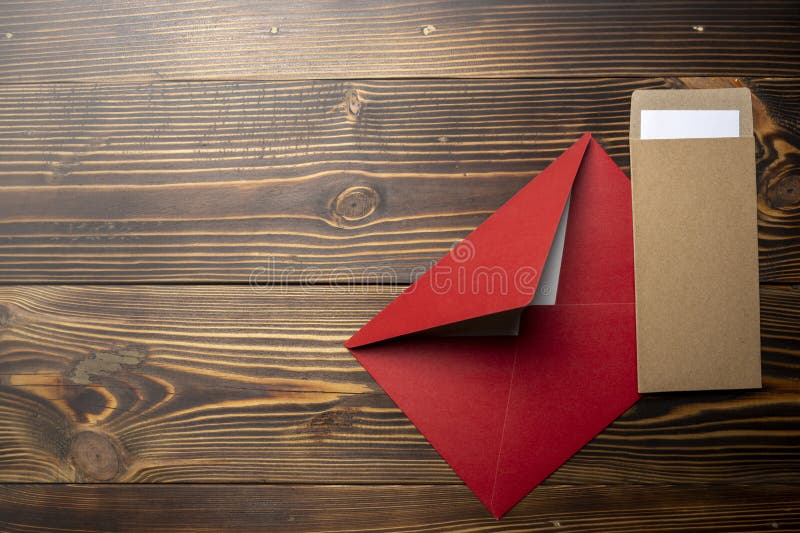 Top View of Stack of Two Envelope and Postcard on Wooden Background ...