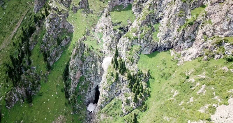 Top View of Steep Mountain Cliffs and an Ice Cave. Stock Footage ...