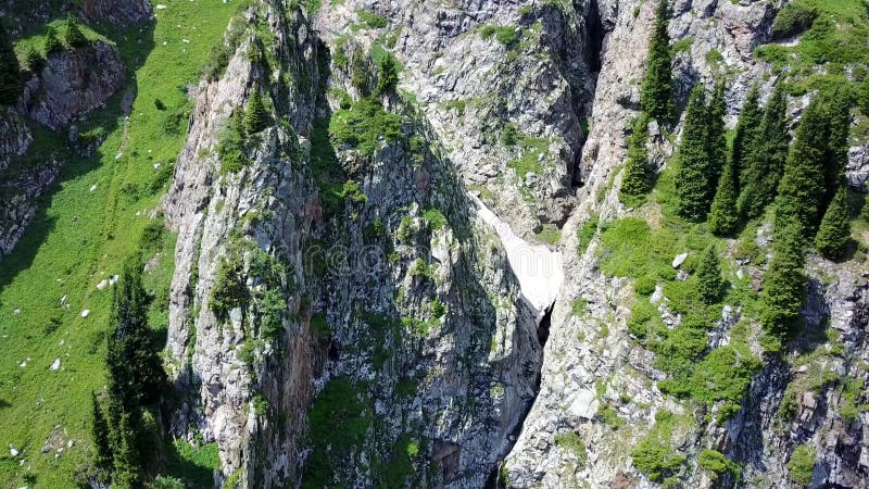 Top View of Steep Mountain Cliffs and an Ice Cave. Stock Footage ...