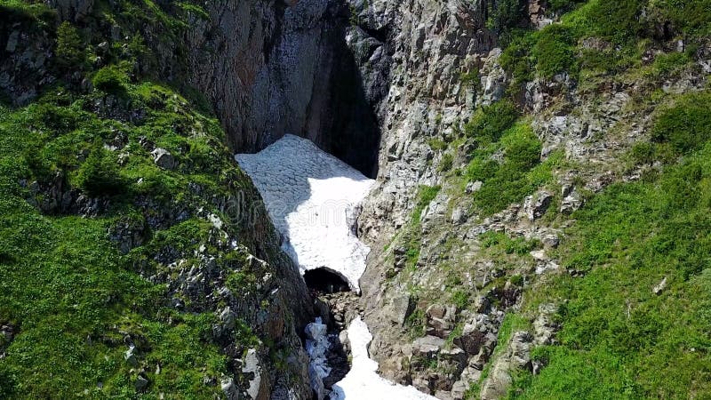 Top View of Steep Mountain Cliffs and an Ice Cave. Stock Footage ...
