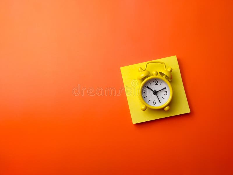 Top View Sticky Note and Alarm Clock on a Orange Background Stock Photo ...