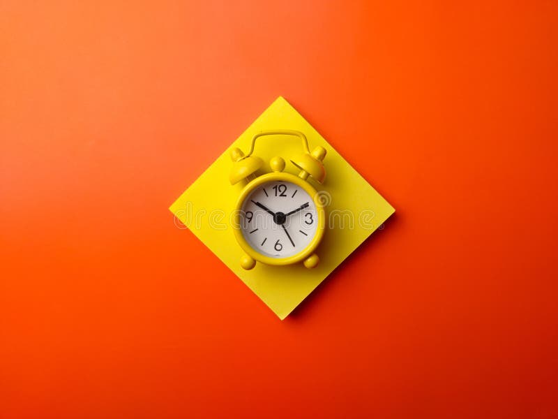 Top View Sticky Note and Alarm Clock on a Orange Background Stock Photo ...