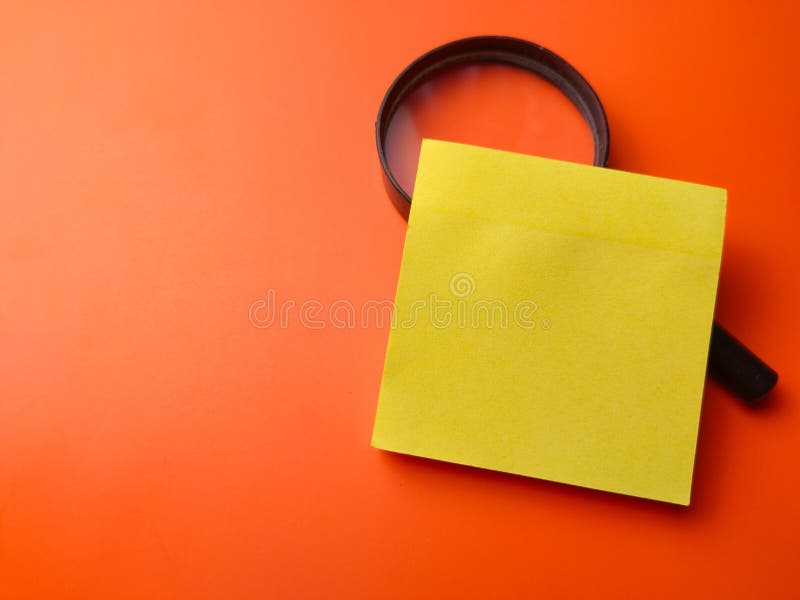 Top View Sticky Note and Magnifying Glass on a Orange Background Stock ...