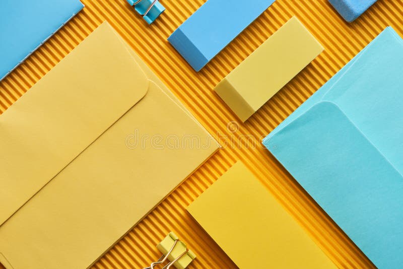 Top View of Sticky Notes, Envelopes and Erasers on Yellow. Stock Image ...