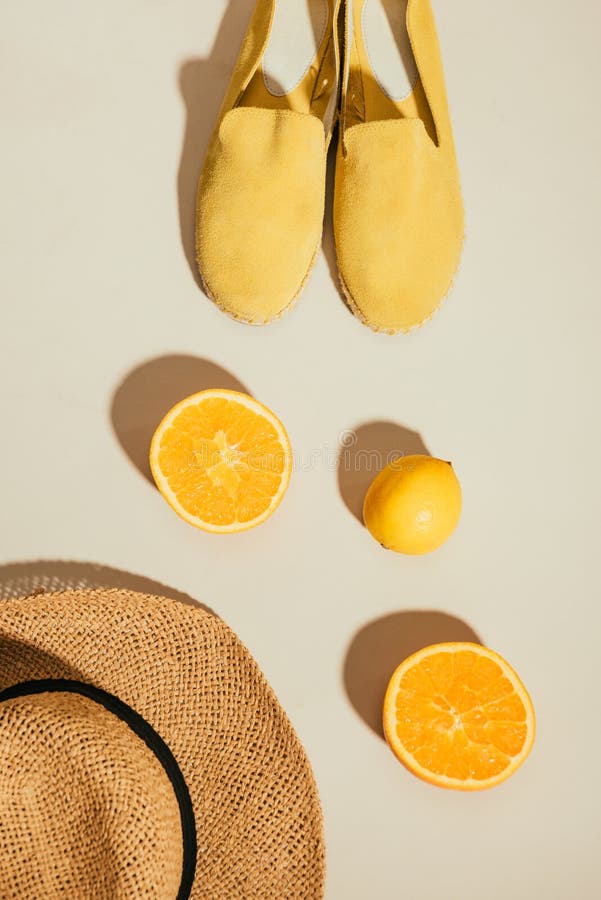 Top View of Straw Hat, Lemon, Orange Slices and Yellow Stock Photo ...