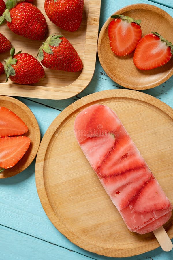 Strawberry Slices Popsicle with Fresh Strawberries Vertical Composition ...