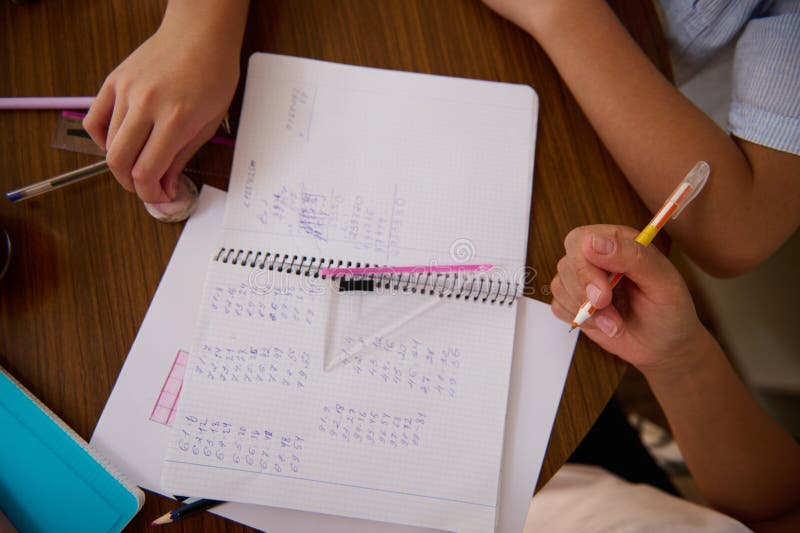 Students Collaborating on Math Homework with Notebooks and Pens Stock ...