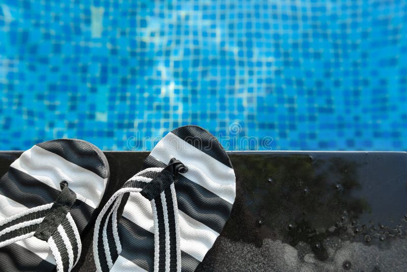 Swimming Pool and Pair of Slippers Stock Photo - Image of poolside ...