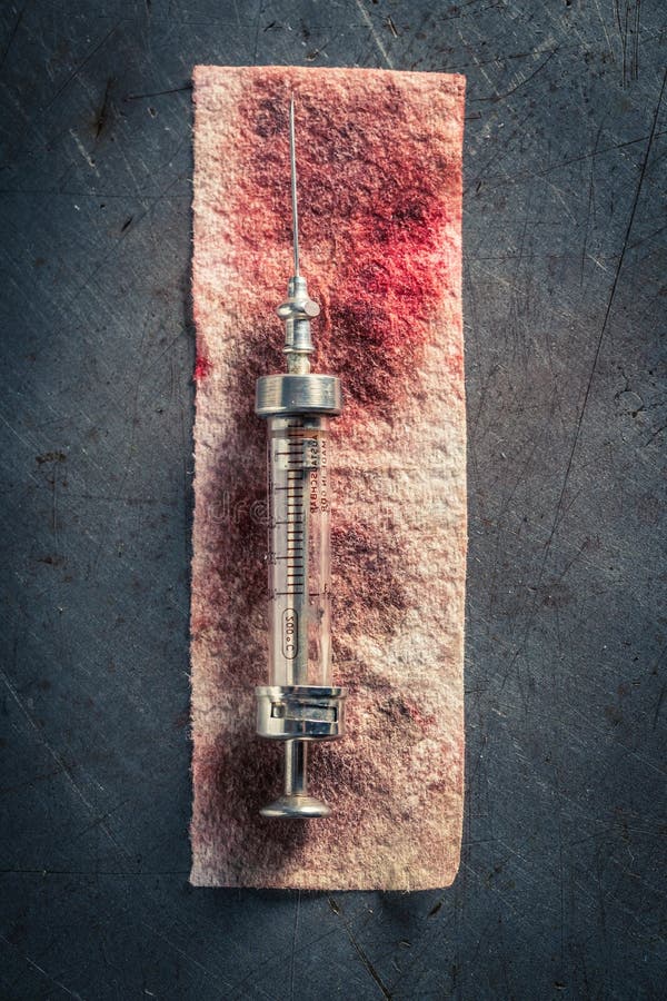Top View of Syringes with a Needle on Red Bandage Stock Photo - Image ...