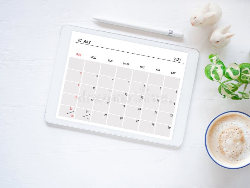 Top View, Tablet Computer with an Open App of the Calendar for July ...