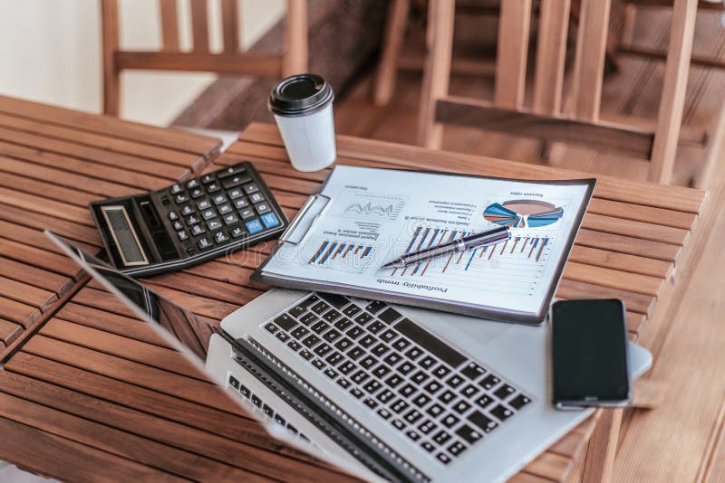 Top View.takeaway Coffee, Financial Chart, and Laptop on Coffee Table ...