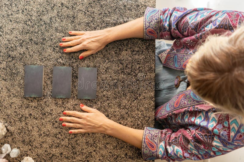 Top View of a Tarot Reader and Three Cards Turned Face Down Stock Photo ...