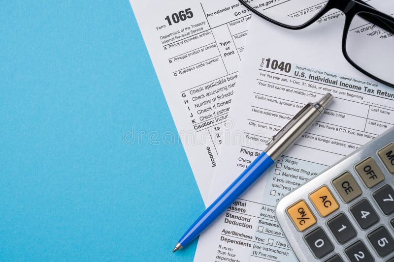 Top View of Tax Forms, Calculator and Pen on Blue Table Stock Photo ...