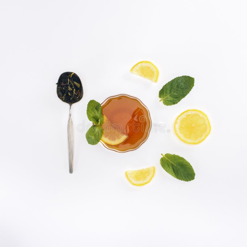 Top View of Tea in Glass, Spoon, Lemon Slices and Mint Leaves Stock ...