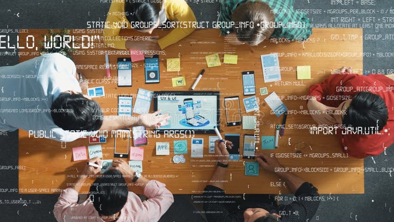 Top View of Team Brainstorm and Looking Tablet with Coding Program ...