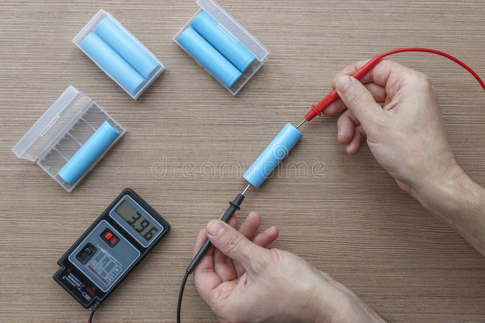 Top View of a Technician S Hands Using a Multimeter To Test Voltage ...