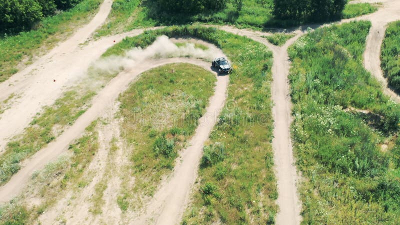 Top View of a Terrain Track with a Racing Car Driving through Stock ...