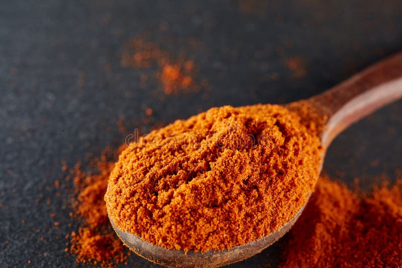 Texture Background. Red Chilli Pepper Powder Mixed with Wooden Spoon ...