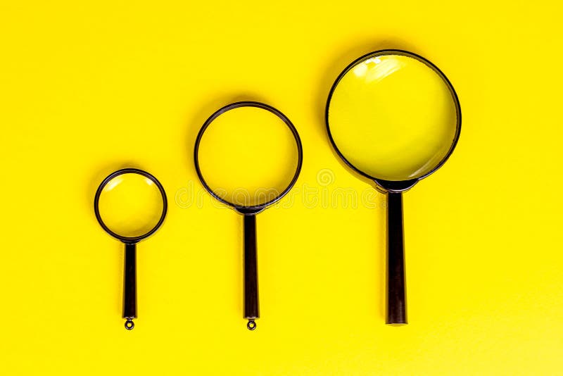 Top View of Three Black Magnifying Glass on Light Yellow Background ...