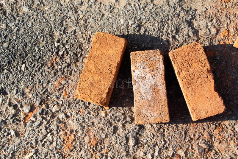 Top View of Three Bricks on a Gray Stone Floor Stock Photo - Image of ...