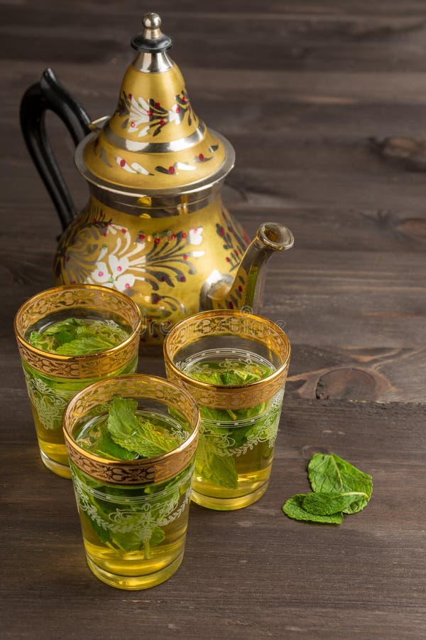 Top View of Three Glasses with Tea and Mint, Decorated Teapot, on Dark ...