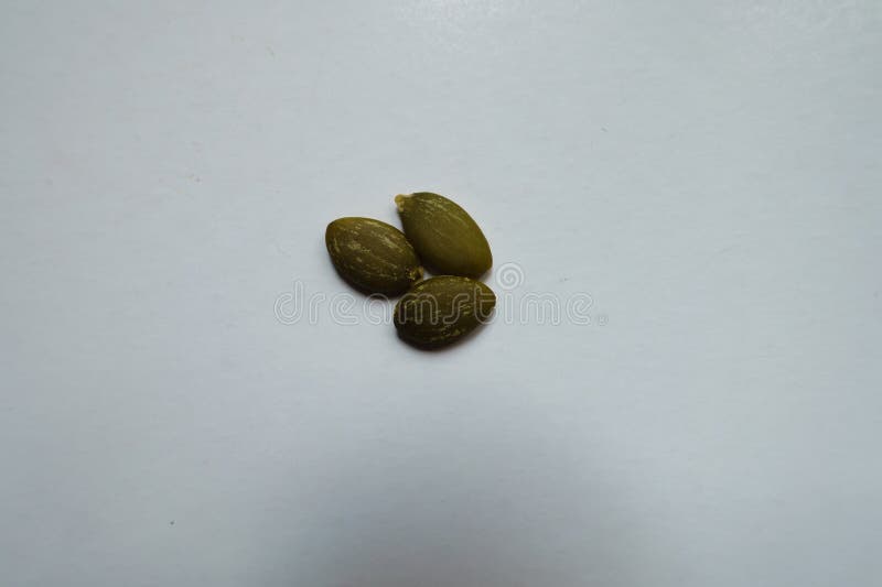 Top View of 3 Hulled Kernels of Pumpkin Seeds Stock Image - Image of ...