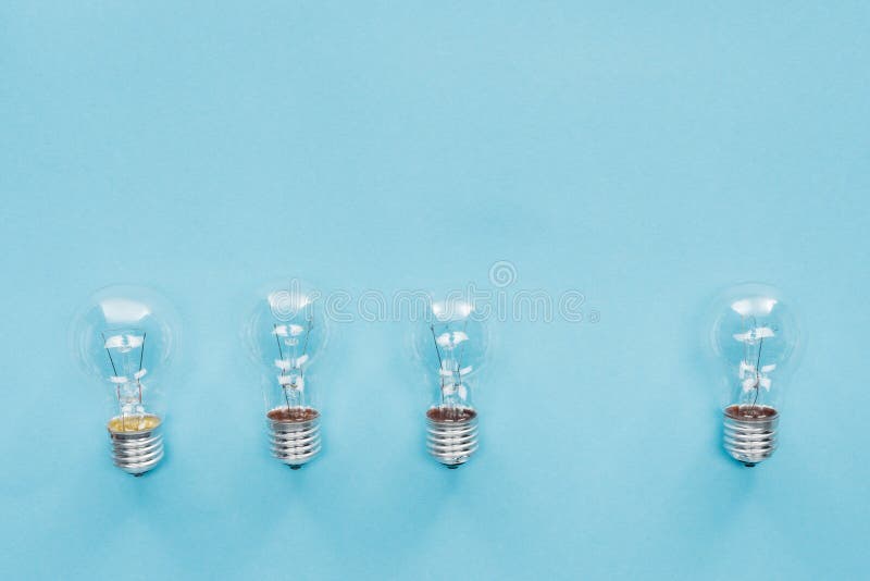 Top View of Three Light Bulbs in Row and One Aside, Stock Photo - Image ...