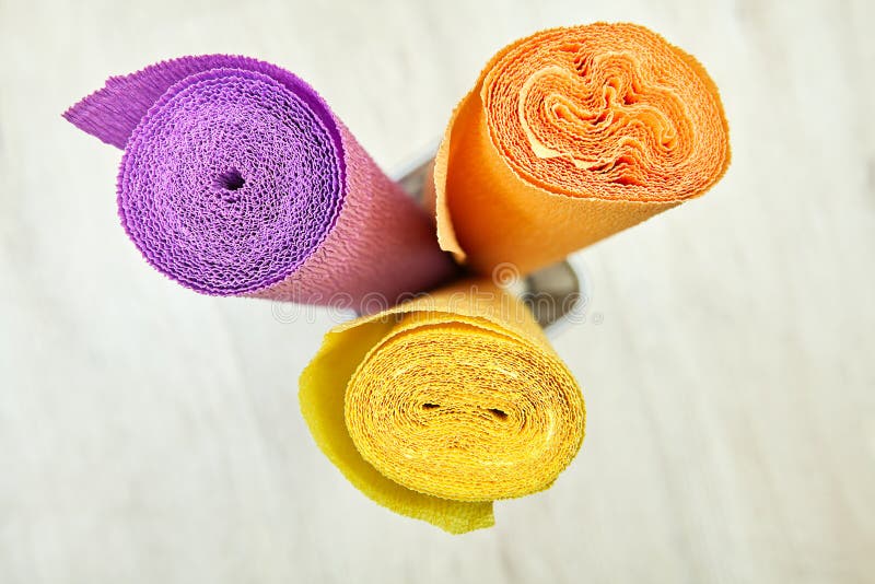 Creped Wrapping Paper is Twisted into Three Colored Rolls. Stock Photo ...