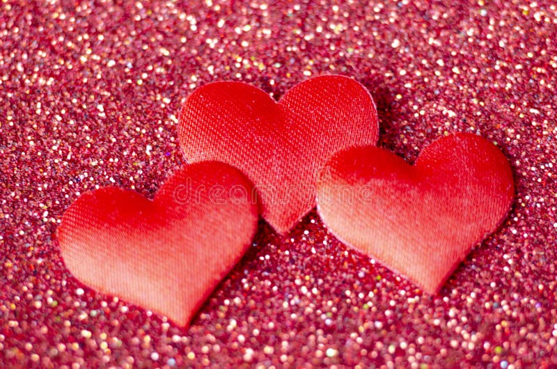 Top View of 3 Tiny Red Hearts on Sparkle Red Background with ...