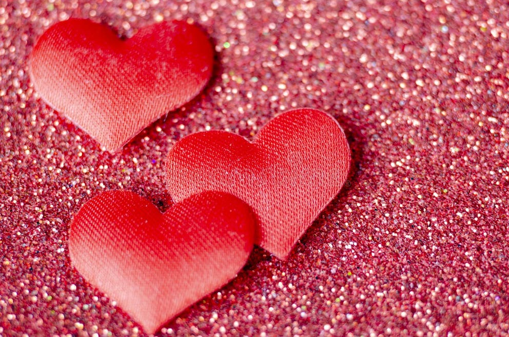 Top View of 3 Tiny Red Hearts on Sparkle Red Background with ...