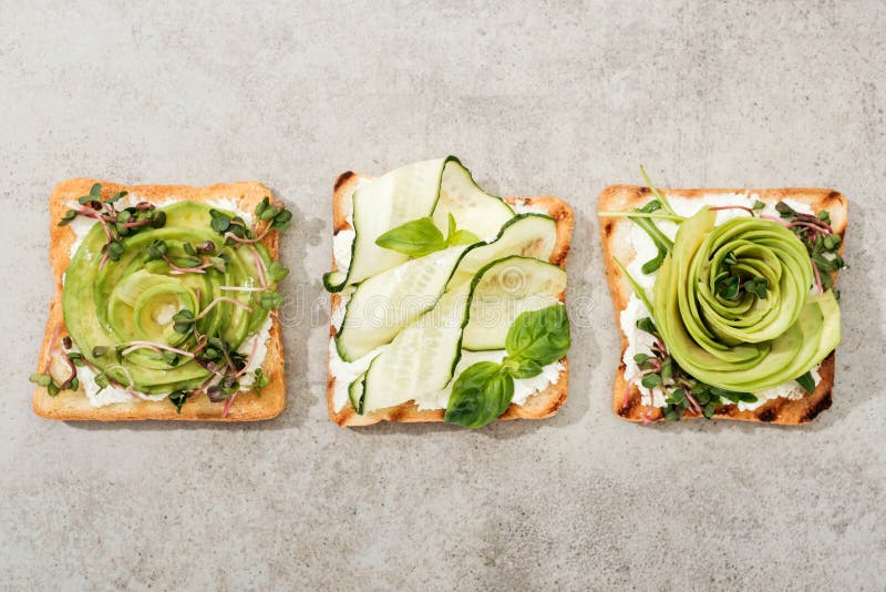 Top View of Toasts with Cut Vegetables on Texture Surface. Stock Image ...