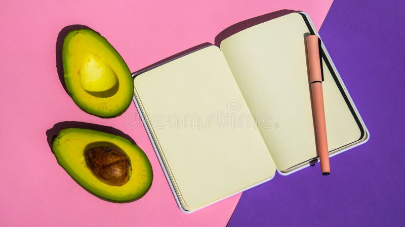 Top View. Top View an Empty Notepad and Sliced Avocado on a Pink ...