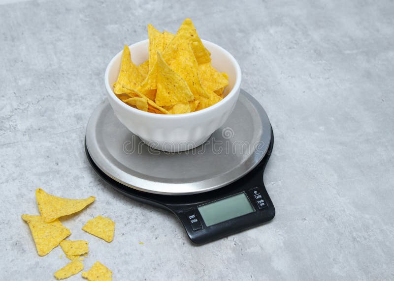 Top View of Tortilla Chips in a White Bowl on a Kitchen Scale, Grey ...
