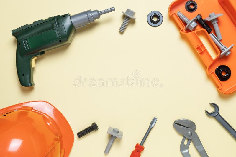 Top View of Toy Construction Tools Border on Yellow Background with ...