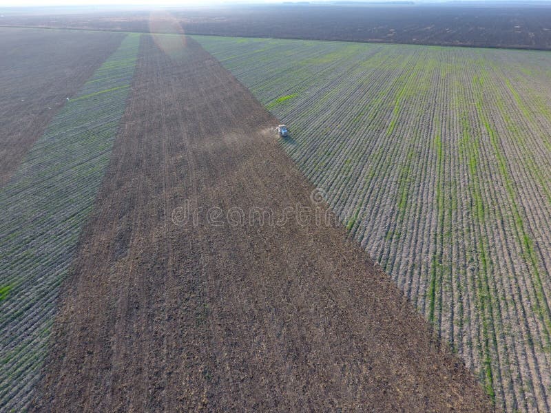 Top View of the Tractor that Plows the Field. Disking the Soil Stock ...