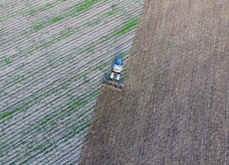 Top View of the Tractor that Plows the Field. Disking the Soil Stock ...