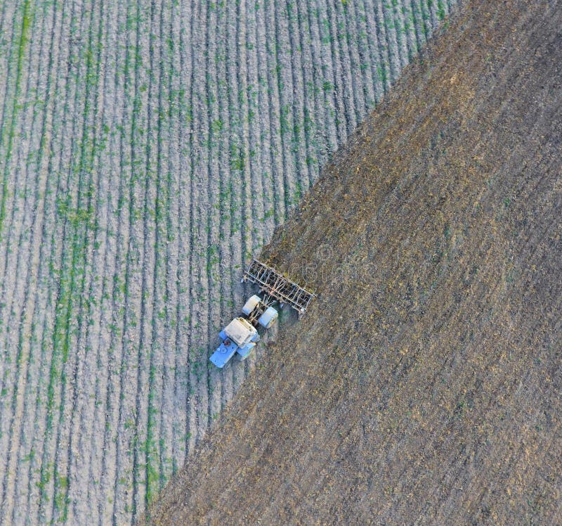 Top View of the Tractor that Plows the Field. Disking the Soil Stock ...
