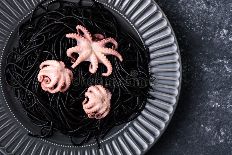 Trendy Black Pasta with Cuttlefish Ink with Octopuses in Grey Plate on ...