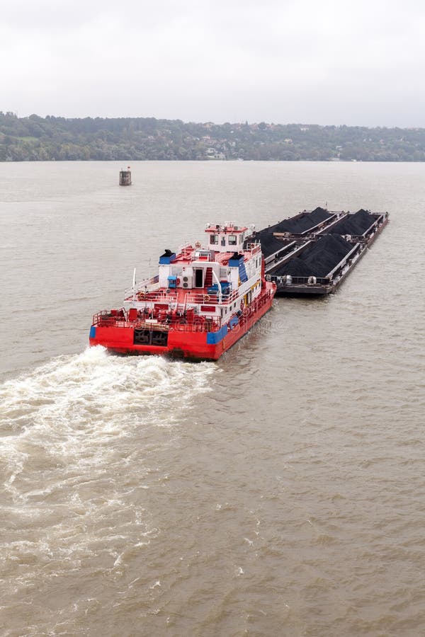 Tugboat Pushing a Heavy Barge Stock Photo - Image of shipping ...