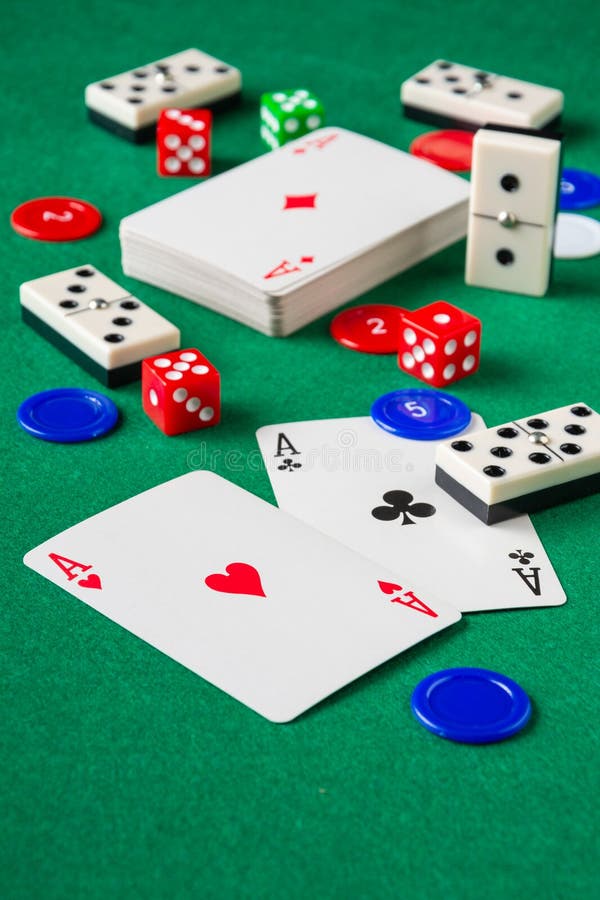 Top View of Two Aces, Deck of Cards, Dominoes and Dice on Green Playing ...